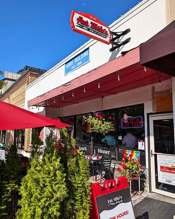 The vintage red awning and outdoor seating under string lights create an inviting atmosphere for any meal of the day.