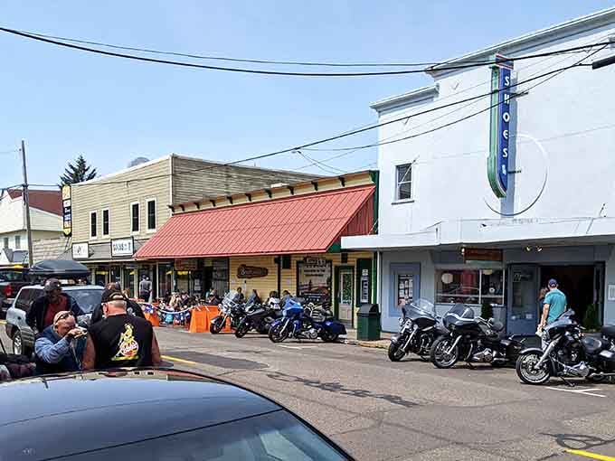 Chrome and leather gleam as motorcycles line up outside Florence's vintage Roxy theater building.