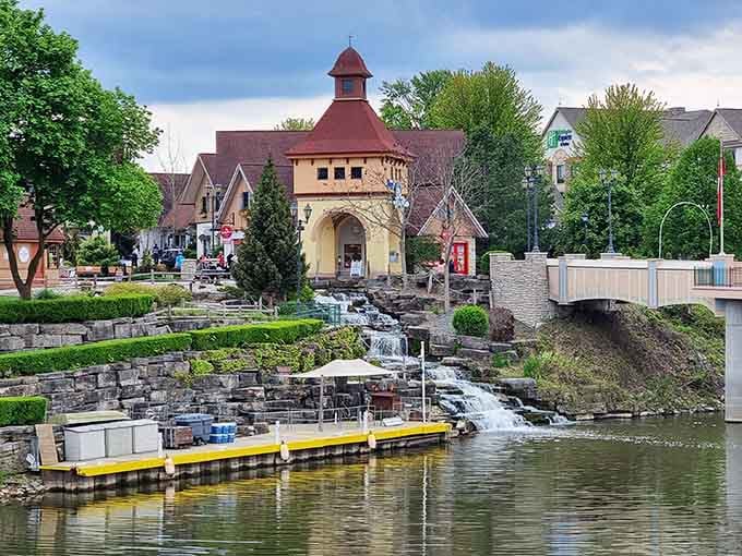 Cascading waterfalls and Bavarian architecture blend into a scene straight from a European fairy tale come alive.