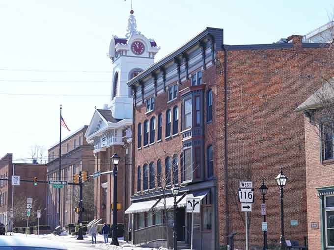 Gettysburg's clock tower watches over brick buildings that witnessed history's most pivotal moments with quiet, steadfast dignity always.