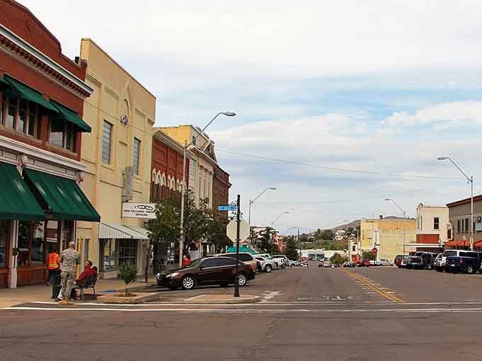 Wide streets and historic facades create a peaceful scene where small-town Arizona life continues at its own pace.