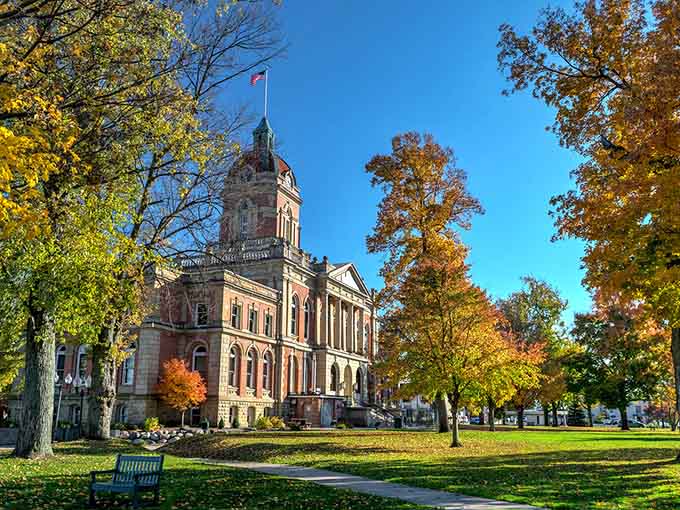 Fall foliage frames this magnificent courthouse like nature's own picture frame, golden and glowing with seasonal magic.