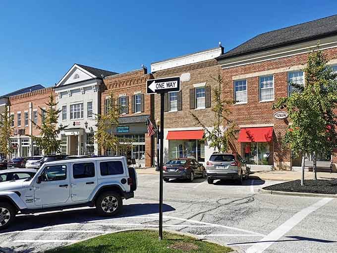 Pristine storefronts with cheerful awnings line the street where modern shopping meets timeless small-town charm and character.
