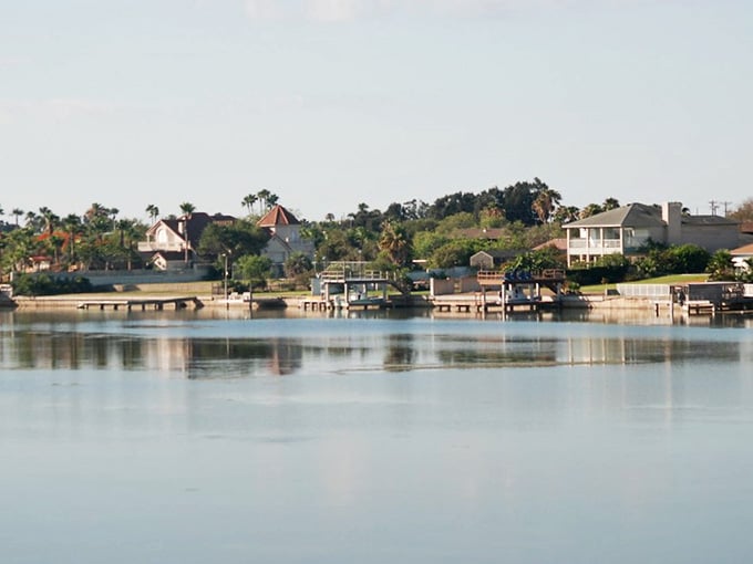 Laguna Vista's waterfront reflects homes and sky in mirror-perfect stillness, like a postcard come to life.