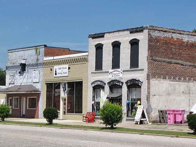 Local shops wear their history proudly with mismatched facades creating an authentic, unpolished charm throughout.