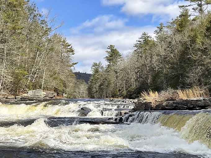 White water rushes over ancient rocks with the kind of raw power that reminds you nature's still boss.
