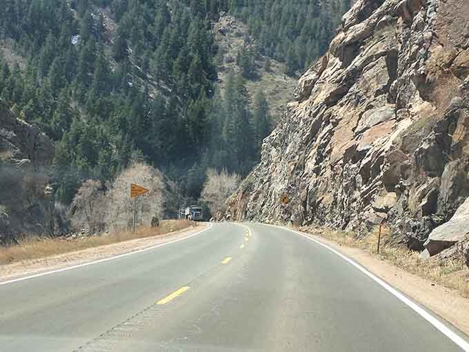 Mountain roads carved through ancient rock tell stories older than any history book you've ever read.