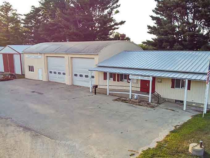 The fire station sits ready among towering pines, serving a community where everyone knows the volunteer firefighters by name.
