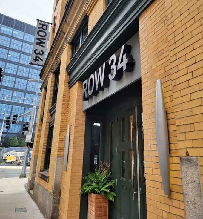 Bold lettering on warm brick announces a modern oyster bar where craft beer meets impeccably fresh shellfish in perfect harmony.