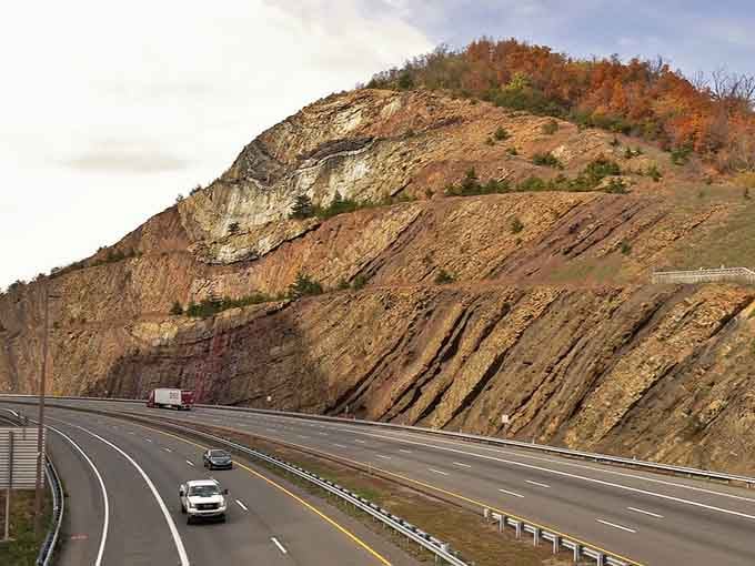 Mother Nature sliced this mountain like layer cake, revealing 350 million years of earth's history in one spectacular roadside display.