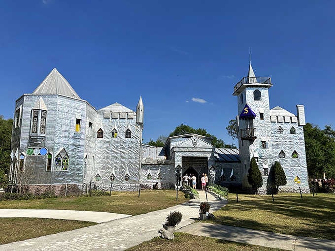 Solomon's shimmering aluminum castle rises from the countryside like a disco ball decided to become medieval architecture.