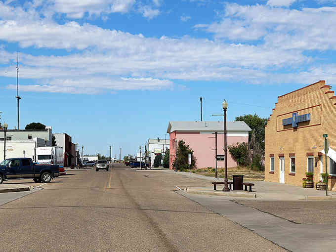 Wide streets and pastel buildings create an unhurried main drag where tumbleweeds have the right of way most afternoons.