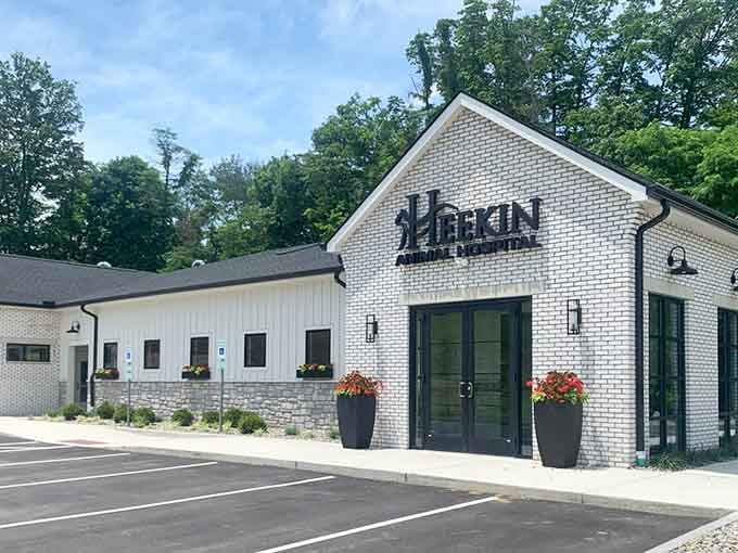 Modern brick meets classic hospitality&mdash;those flower baskets flanking the entrance aren't just decoration, they're a warm handshake in plant form.