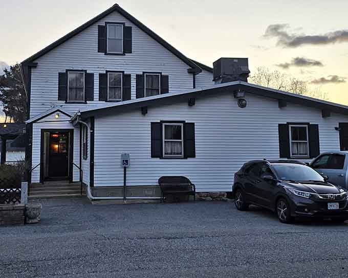 The white clapboard exterior with black shutters exudes timeless New England charm where tradition and excellent food have coexisted for generations.