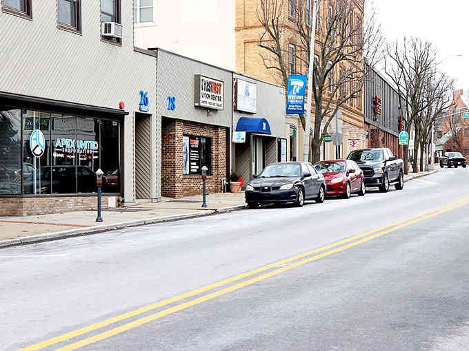 Small-town storefronts maintain their authentic character, where local businesses still know their customers by name and preference.