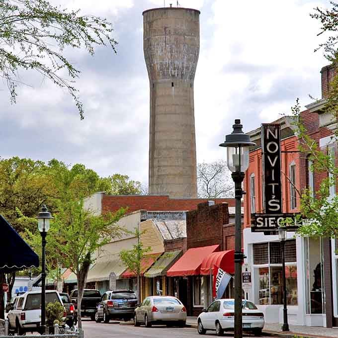 The old water tower rises above downtown like a concrete lighthouse guiding folks home to this charming riverside community.