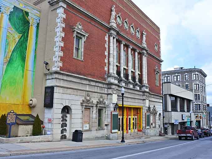 That ornate classical theater facade stands as a testament to when communities built entertainment venues like temples of culture and joy.