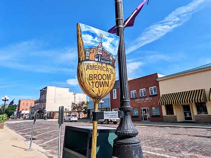 America's Broom Town announces itself proudly on this hand-carved sign, celebrating heritage with whimsy and genuine local pride.