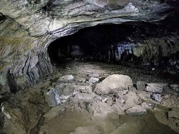 The rippled ceiling shows exactly how molten lava once flowed through here like an underground river.