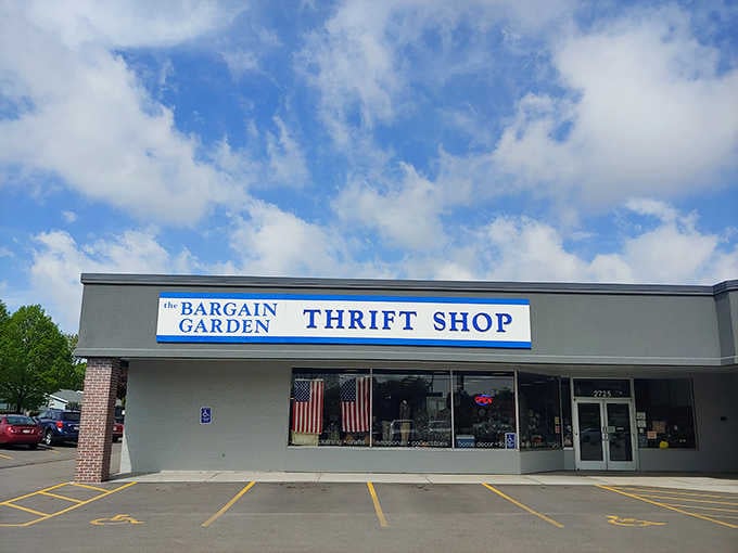 Old Glory waves proudly behind windows showcasing deals that prove patriotic shopping means supporting your local community thrift stores.