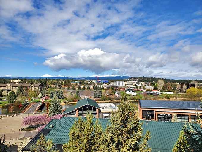 Green rooftops and riverside paths show how Bend balances nature and development under those famous blue skies.