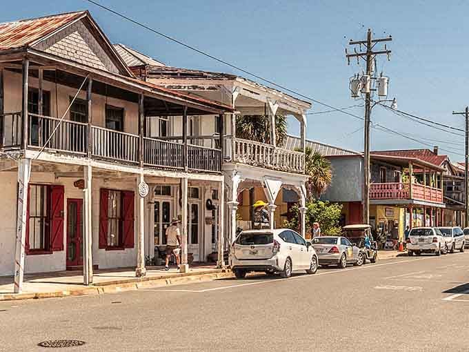 Historic storefronts line the quiet street where life moves slower and neighbors still wave from their front porches.