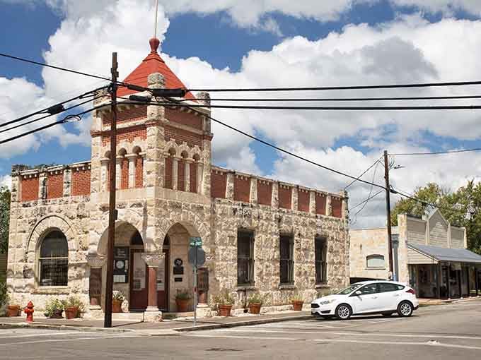 The red-tiled dome and stone fortress walls make this corner look ready to defend against anything except curious tourists with cameras.