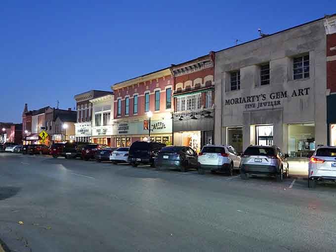 Evening lights illuminate streets where window shopping feels like an event and every storefront tells its own welcoming story.