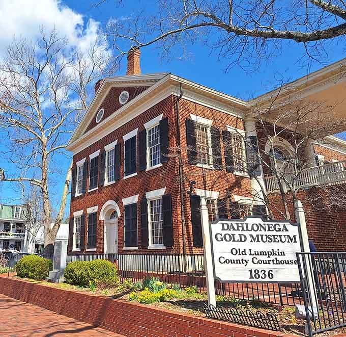 Classic Federal architecture and bare winter branches create a timeless scene at this historic gold rush landmark.