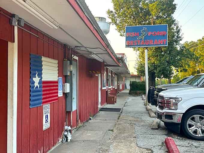 That corrugated metal awning and patriotic banner signal honest food served with genuine Texas pride and warmth.