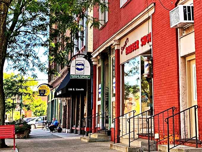 Historic storefronts with their vintage signs create a streetscape that Instagram filters try desperately to replicate but never match.