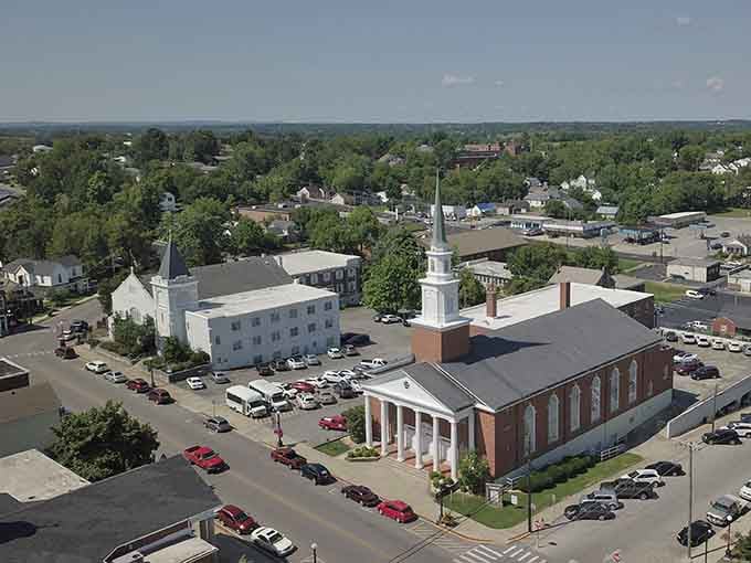 Church steeples punctuate the tree-filled skyline in this aerial view of small-town Kentucky at its finest.