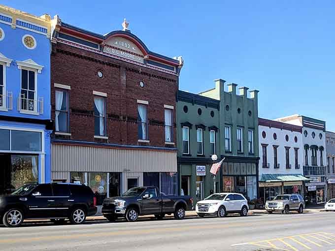 Bright storefronts pop against historic facades, proving old buildings can embrace modern touches without losing their dignified character.
