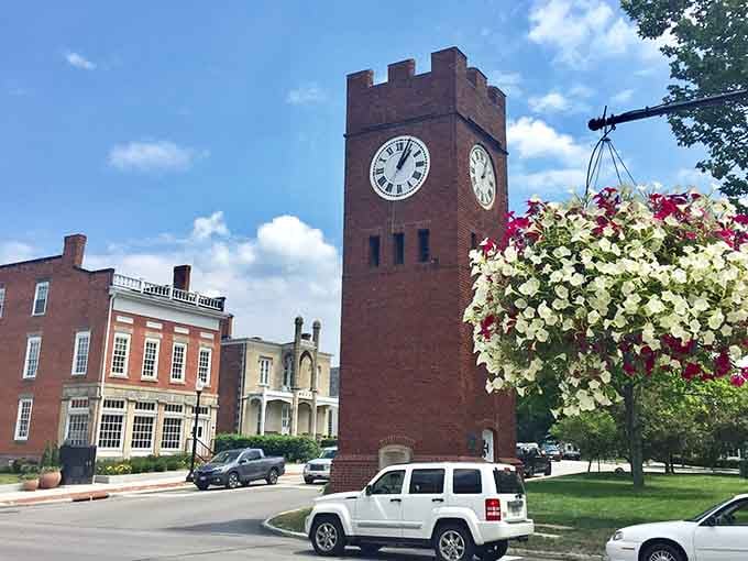 That brick clock tower stands tall like the town's grandfather, keeping watch over the community with steady reliability.
