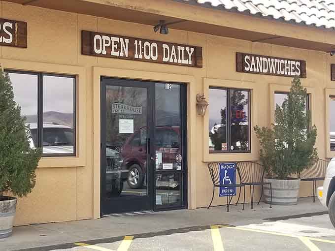 That welcoming entrance opens daily at 11:00, ready to serve hungry travelers exceptional beef all day.