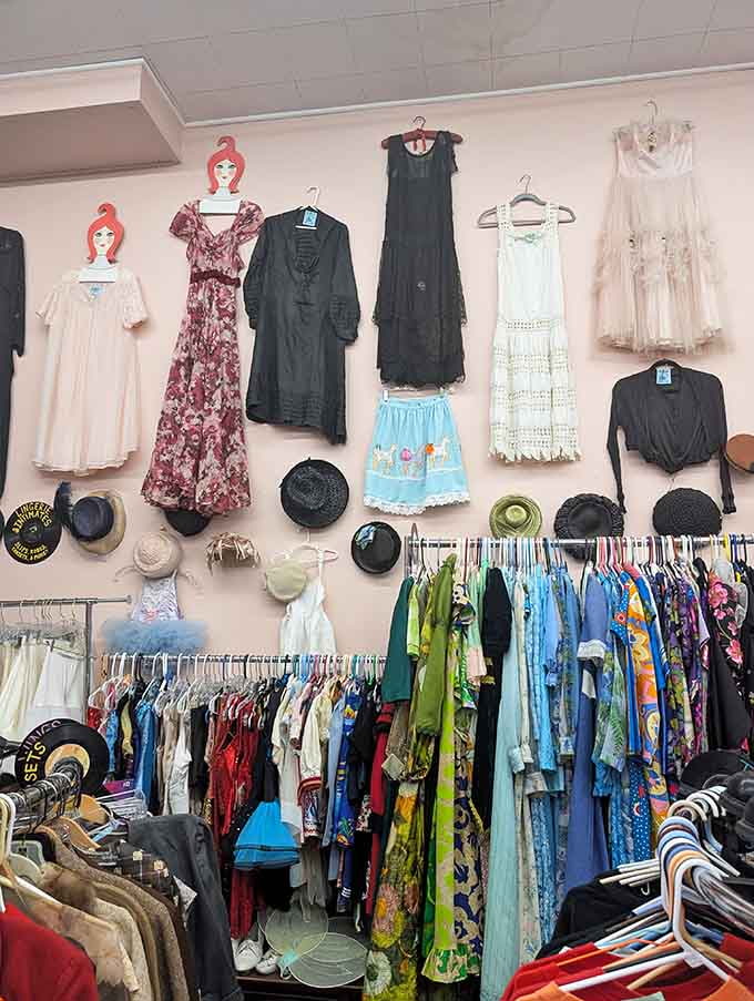 The pink walls and carefully displayed vintage dresses make every visit feel like treasure hunting with style.