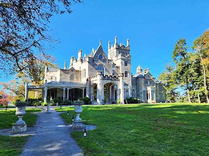 The sweeping lawn leads your eye straight to those pointed arches, like a green carpet rolled out for royalty.