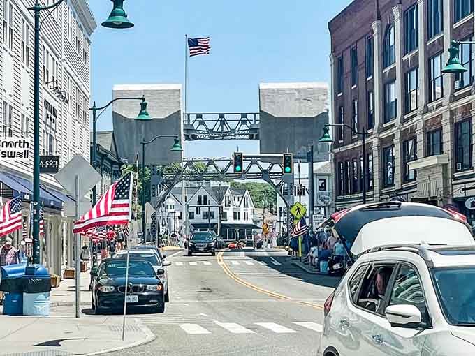 The iconic drawbridge frames Mystic's bustling street scene where maritime heritage meets modern life in perfect harmony and balance.