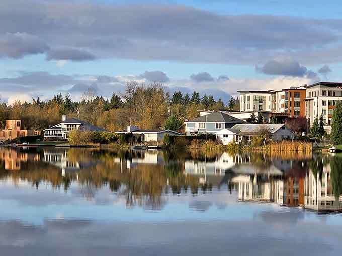 Perfect reflections on still water create a mirror image that doubles the beauty of this tranquil lakeside community scene.