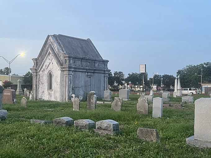 That Gothic-style mausoleum rises like something from a Southern Gothic novel, its weathered walls holding centuries of island history.