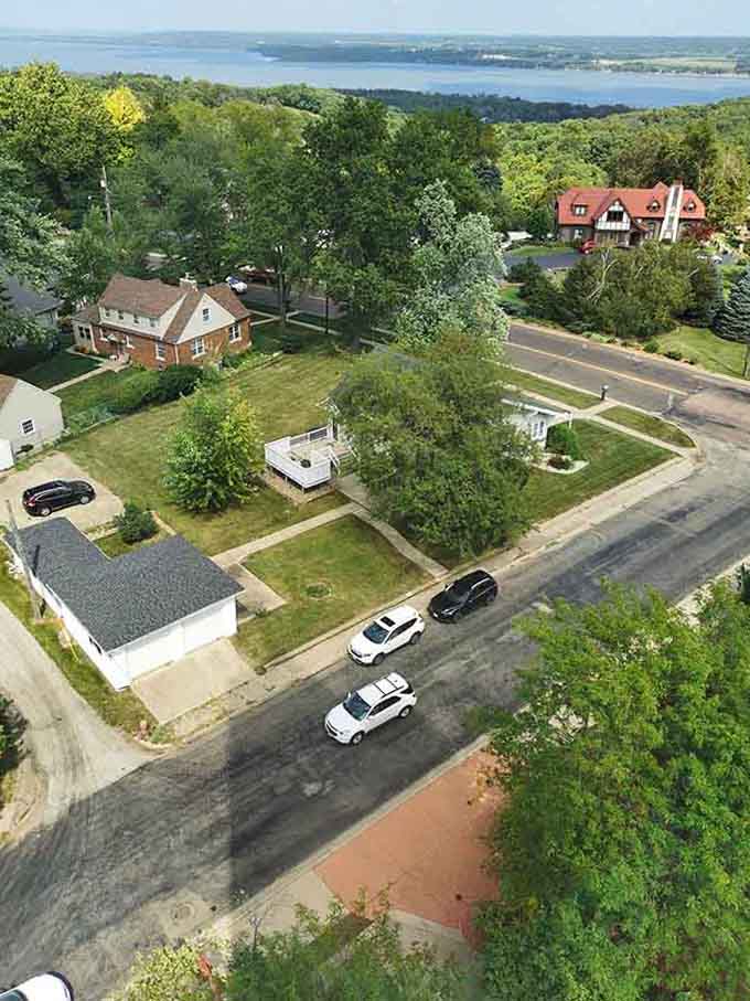 Tree-canopied streets and brick homes overlook the water, proving river towns know how to pick their real estate.