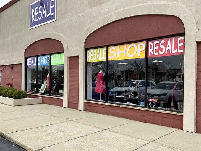 Arched windows frame a resale shop where every colorful sign reminds you that one person's maybe is another's definitely.
