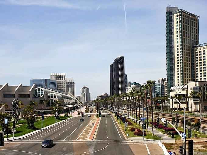 Palm-lined boulevards stretching toward modern towers create a skyline that says "California dreaming" in every direction.