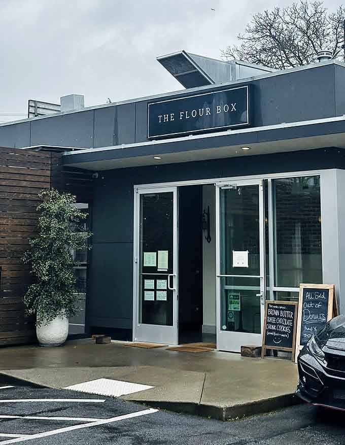 The minimalist design and chalkboard menu hint at artisanal treats crafted with care behind those modern glass doors.