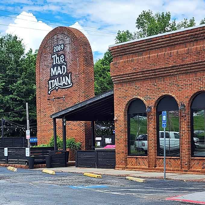 That distinctive curved facade makes The Mad Italian impossible to miss, like a delicious beacon calling hungry travelers home.