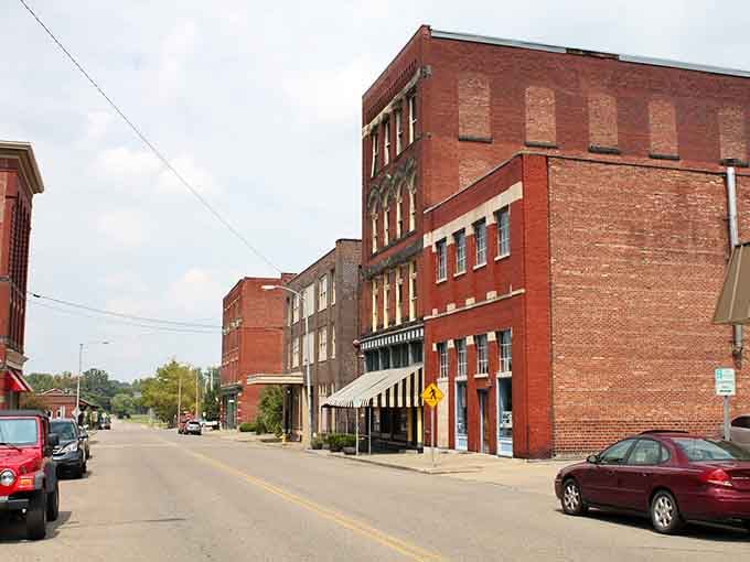 Red brick industrial buildings tell stories of manufacturing days when these streets hummed with activity and purpose.