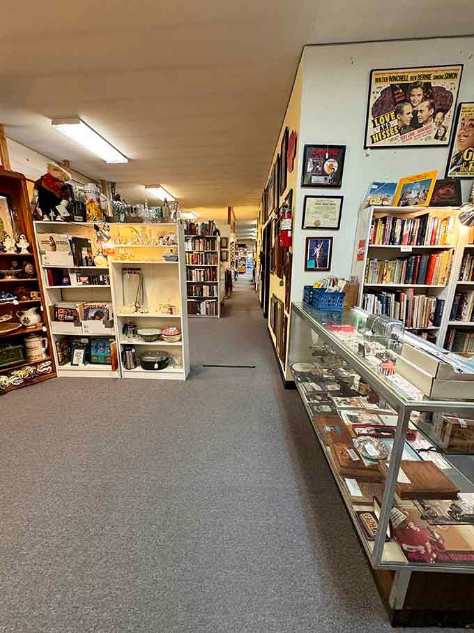 Aisles stretching into the distance like a treasure hunter's dream, with vintage movie posters keeping watch overhead.