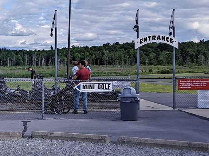 The gateway to adventure, where mini golf enthusiasts and speed junkies peacefully coexist in perfect harmony.