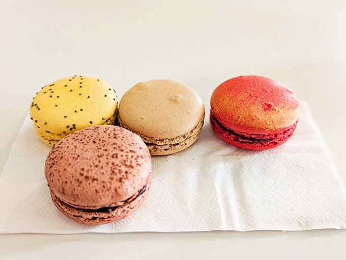 Macarons in every color of the rainbow, each one a tiny edible work of art.