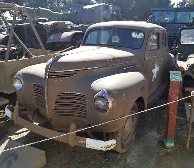 That vintage Plymouth staff car proves even generals appreciated a smooth ride between commanding troops and planning operations.